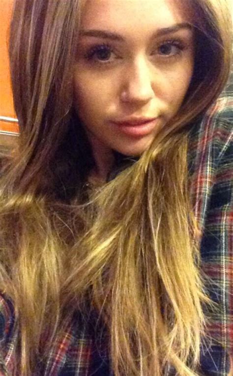 Miley Cyrus Wigs Out Goes Back To Long Brunette Locks And Tries Out