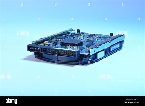 Used Hard Disk Isolated On White Background And Blue Backlight Stock
