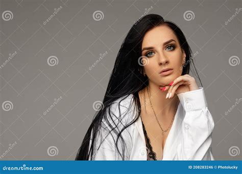 Fit Young Brunette Female Wearing Shirt With Naked Legs Sitting On