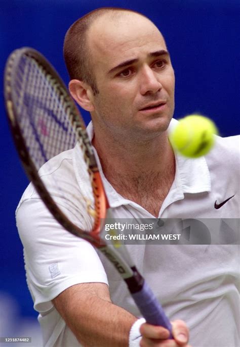 Andre Agassi Of The Usa Volleys A Return To Sjeng Schalken Of The