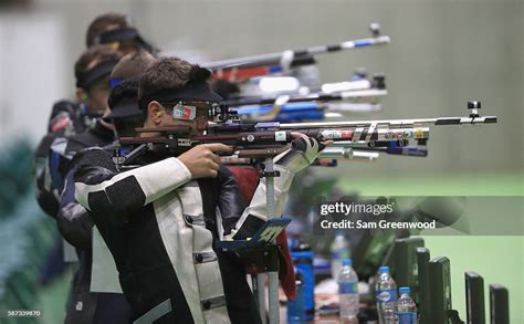 Athletes Compete In The Qualifying Portion Of The 10m Air Rifle Event