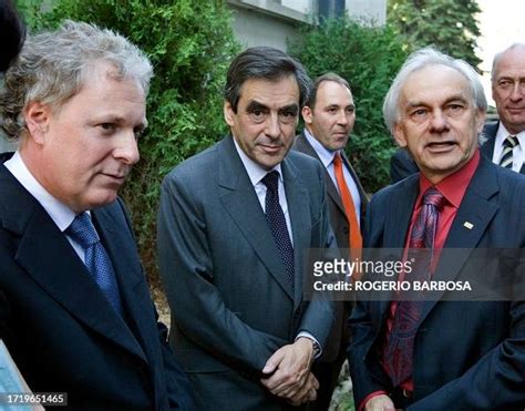 Quebec Prime Minister Jean Charest Stands With French Prime Minister