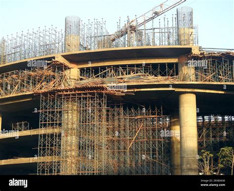 A Construction Site Of A New Building With Crane Tower Metal