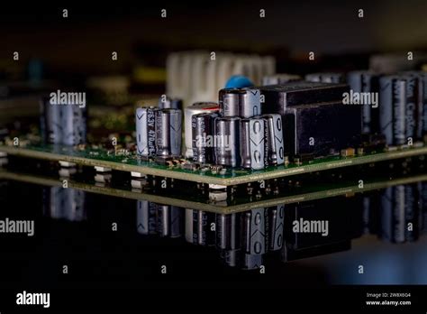 Close Up Of A Computer Mainboard With Transistors And Electrolytic Close Up Of A Computer Mainboard With Transistors And Electrolytic
