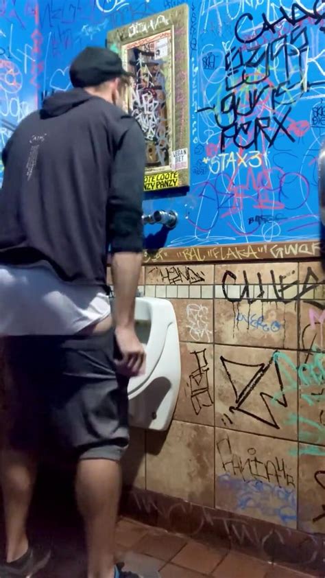 Showing Off Tighty Whities At Urinal