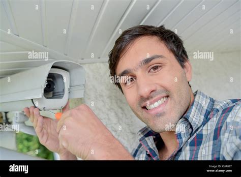 Installing A Security Camera Stock Photo Alamy