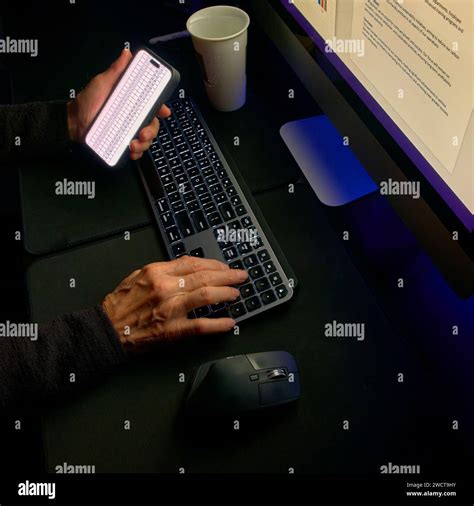A Professional Simultaneously Manages Tasks On A Smartphone And Computer Showcasing
