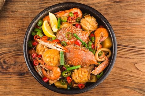 Premium Photo Mixed Seafood Dry Pot Crab Abalone Shrimp