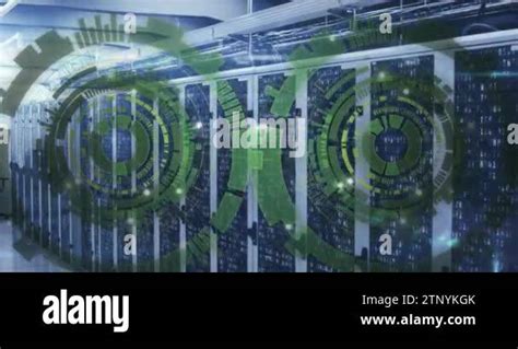 Animation Of Loading Circles Over Binary Codes On Data Server Racks In Server Room Digital