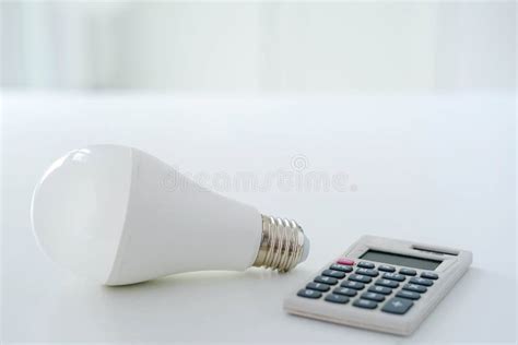 Energy Saving Concept Calculator With Light Bulb Stock Image Image Of Electric Energy 254344209