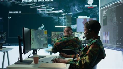 Team Of Military Specialists In Command Post Monitoring Satellite Data Stock Image Image Of