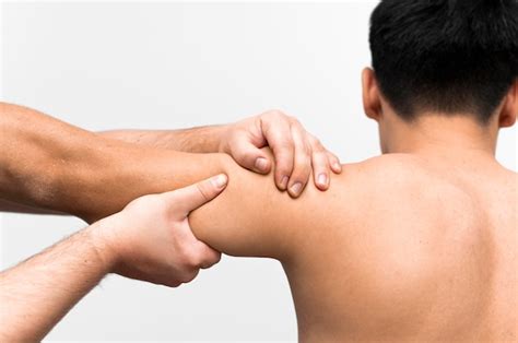 Free Photo Man Getting Shoulder Massage From Physiotherapist