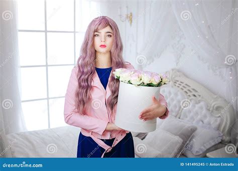 Fashion Freak Glamour Synthetic Girl Fake Doll With Empty Look And Short Black Hair Is Holding