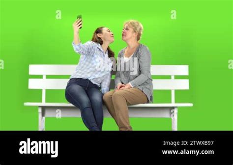 Mom And Daughter Do Selfie Green Screen Stock Video Footage Alamy