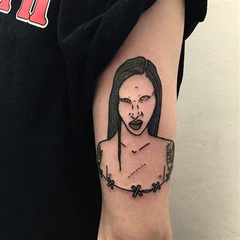 Marilyn Manson Symbol Tattoos