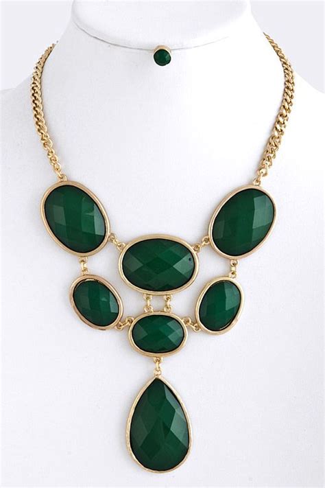 Gold Necklace Adorn In Green Gems Connected To Bring Together A