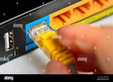Connecting Network Plug On Router Stock Photo Alamy