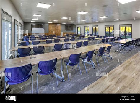 Tables And Chairs Arranged In Rows In A New Modern Training Conference Room In A Modern