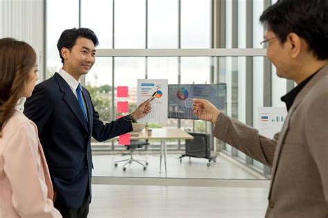 Professional Man Woman Stand Together Engaged Brainstorming Session Using Document Colorful