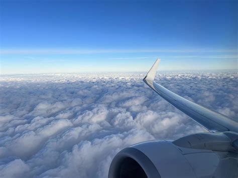View From The Airplane Window Beautiful Cloudscape With Blue Sky