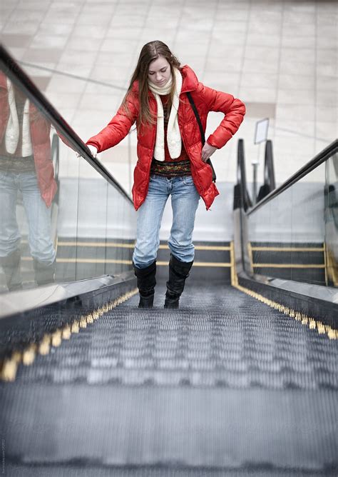 Babe Woman On The Escalator By Stocksy Contributor Ilya Stocksy