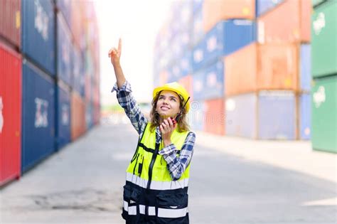 Container Operators Wearing Helmets And Safety Vests Control Via Walkie Talkie Workers In