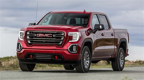 Download Gmc Sierra Truck On A Mountain Road Wallpaper