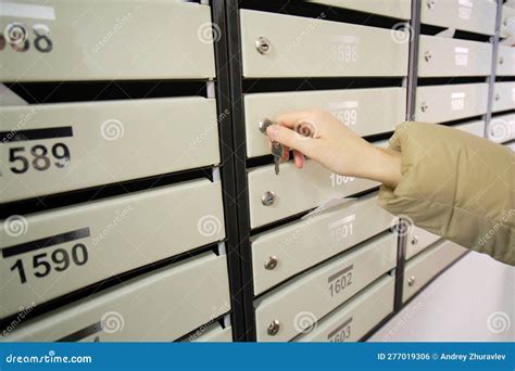 A Woman Hand Opens A Mailbox In An Apartment Building With A Key M Stock Photo Image Of