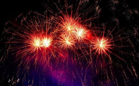 Vibrant Display Of Red Fireworks Exploding Against A Dark Night Sky Stock Image Image Of