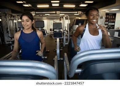 Woman Using Treadmill Over Royalty Free Licensable Stock Photos
