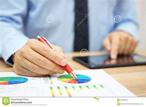Financial Worker Analyzing Business Data And Working With Tablet Stock