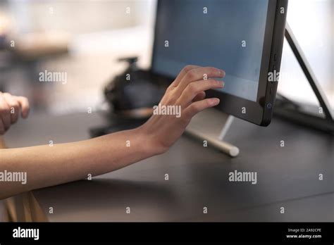 Female Hand When Working On The Touch Screen Monitor Special Equipment Stock Photo Alamy