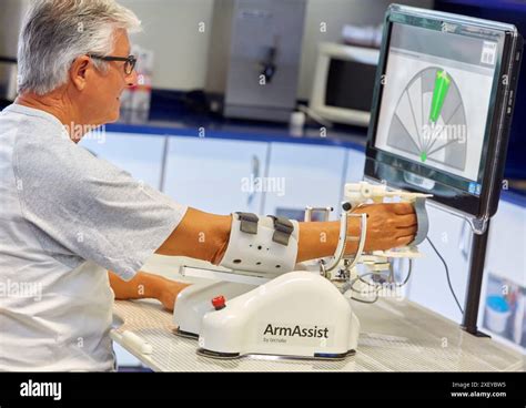 Patient With Assistive Robot For Upper Limb Rehabilitation The Robot Armassist Allows Passive