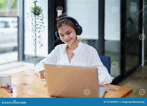 Woman Using A Computer And Earphone During A Video Conference Stock Image Image Of Laptop