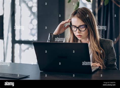 Concentrated Businesswoman Thinking About A Complex Problem Solution
