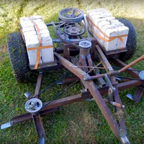 this motorless pull behind mower is made from junk hackaday