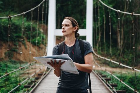 Premium Photo Confused Caucasian Man Looking At A Map Travel And Explore Concept