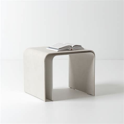 The Overall Shape Of The Side Table Is A Fluid Curve With Different
