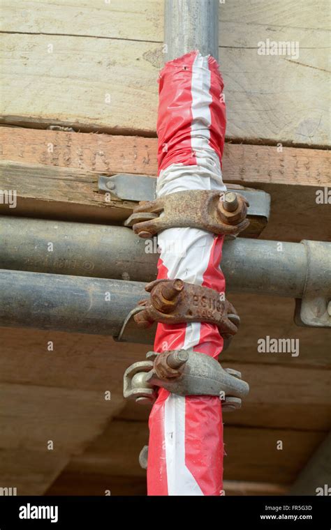 Scaffolding Poles With Mid Rail Brace With Rigid Clamps On Construction