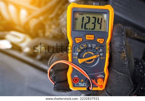 Checking Car Battery Voltage Mechanic Check Stock Photo Shutterstock