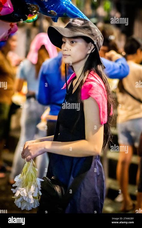A Pretty Young Filipino Girl Sells Flower Garlands At Santo Nino De