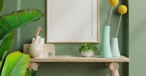 녹색 벽 뒤에 선반에 있는 인테리어 나무 프레임 모형3d 렌더링 사진 Unsplash의 그린 오피스 이미지