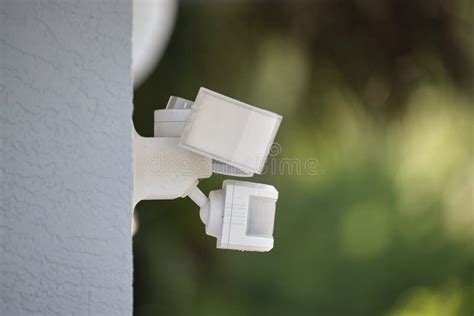 Motion Sensor With Light Detector Mounted On Exterior Wall Of Private House As Part Of Security