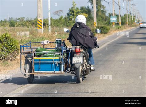 THAILAND JAN 21 2023 A Man Carries A Load On A Sidecar Stock Photo