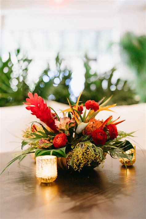 Exotic Tropical Wedding Centerpieces Bursting With Orange Blooms