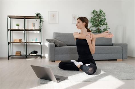 Premium Photo Woman Stretching With Laptop