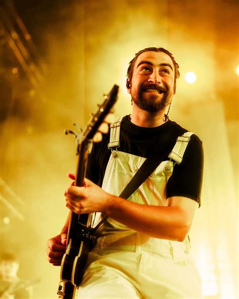 Download Guitarist Performingon Stage Wallpaper