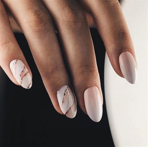 Gradient And Pink Marble Effect Nails Decorated With Subtle Glitter Details Seen In Close Up