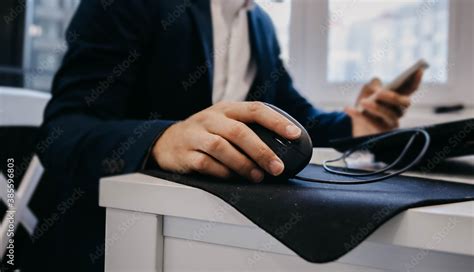 Office Worker Uses An Ergonomic Vertical Computer Mouse Stock Photo Adobe Stock