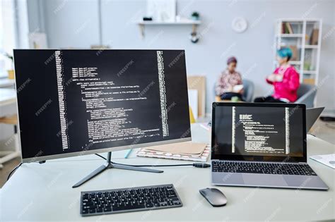 Premium Photo Background Image Of Computer Screens With Code Lines On Desk